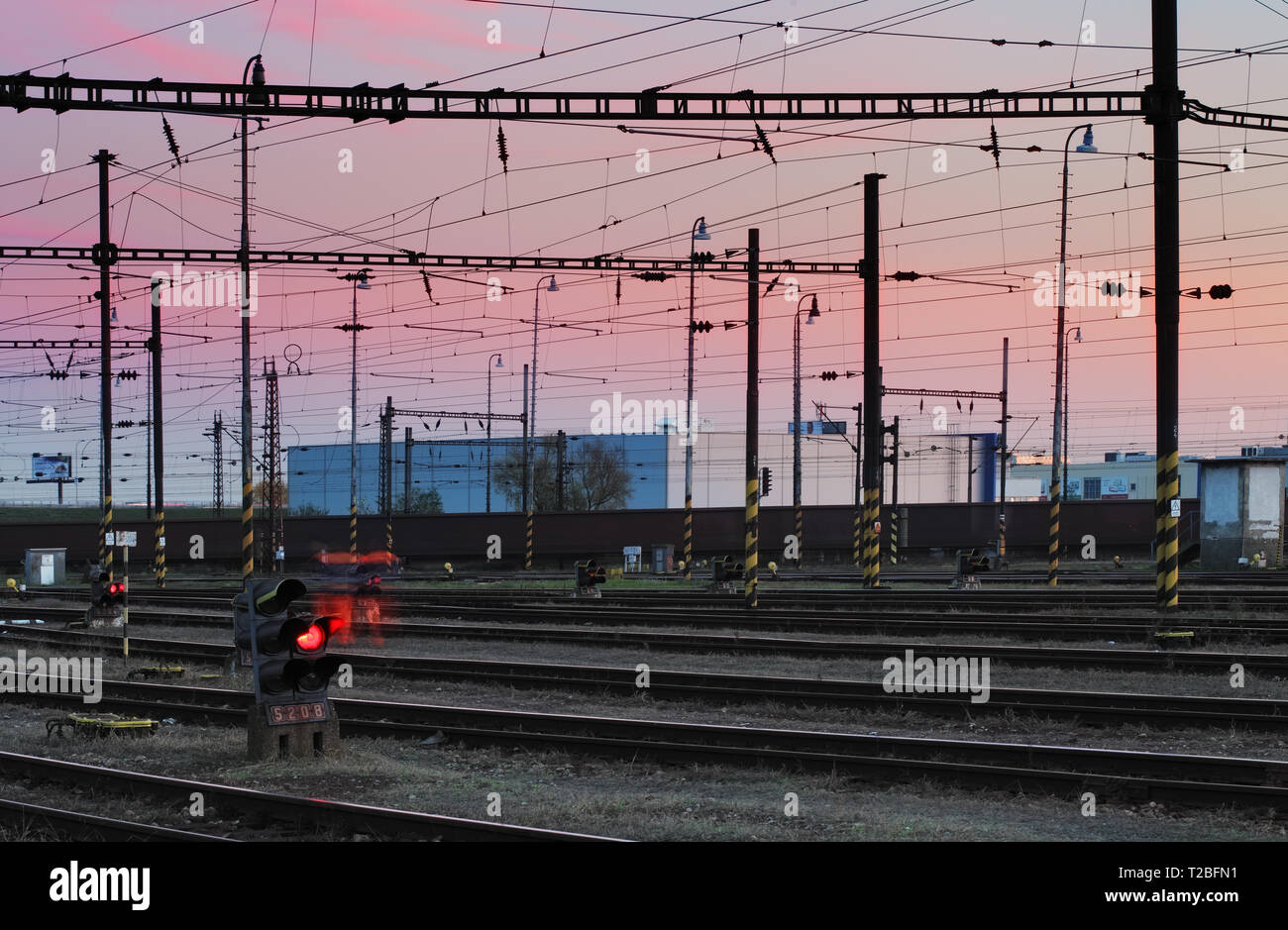 Railway Tracks at a pink colorful sunset Stock Photo - Alamy