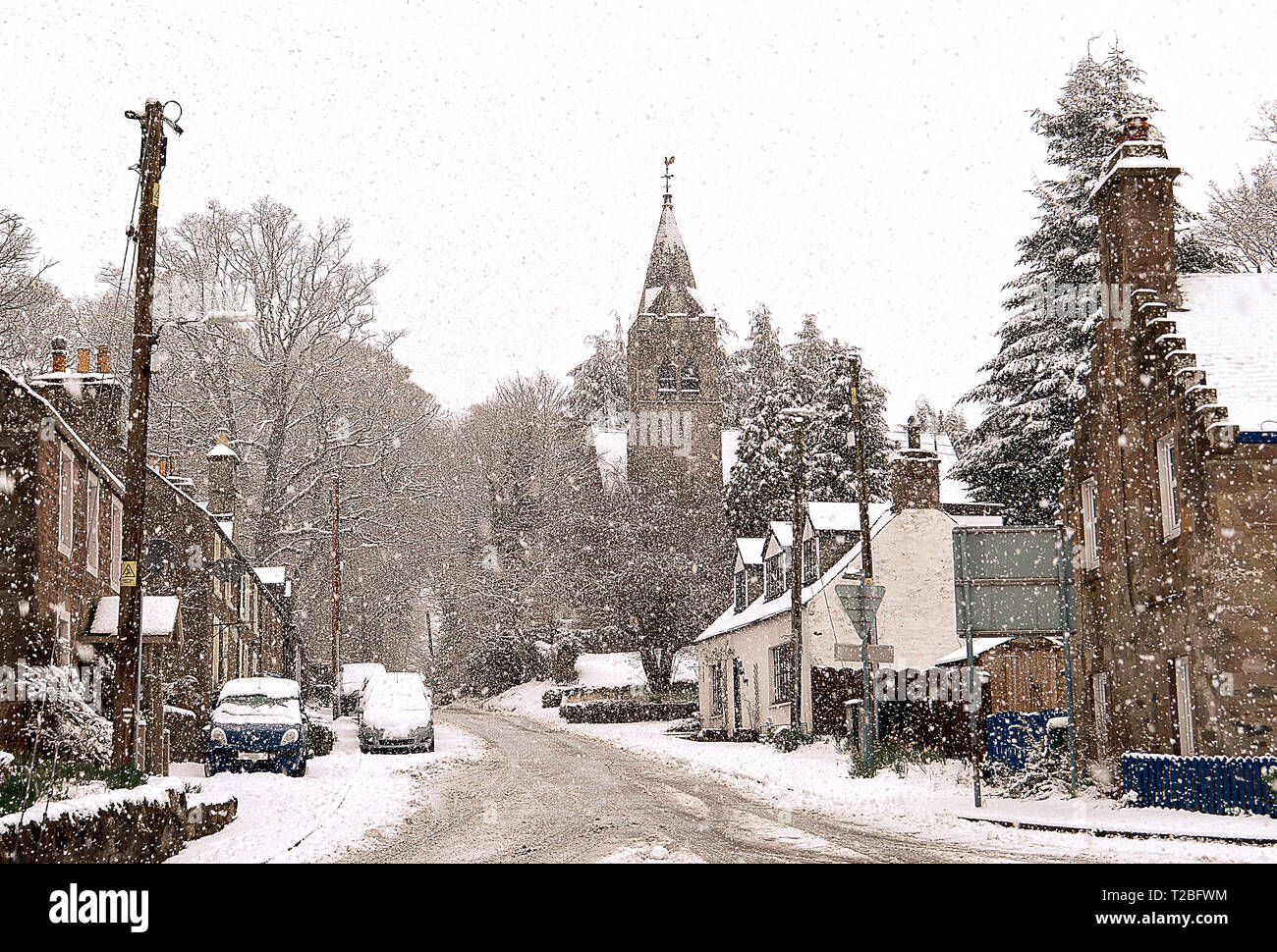 Village of Gilmerton, Perthshire , during late winter snowfall in March ...