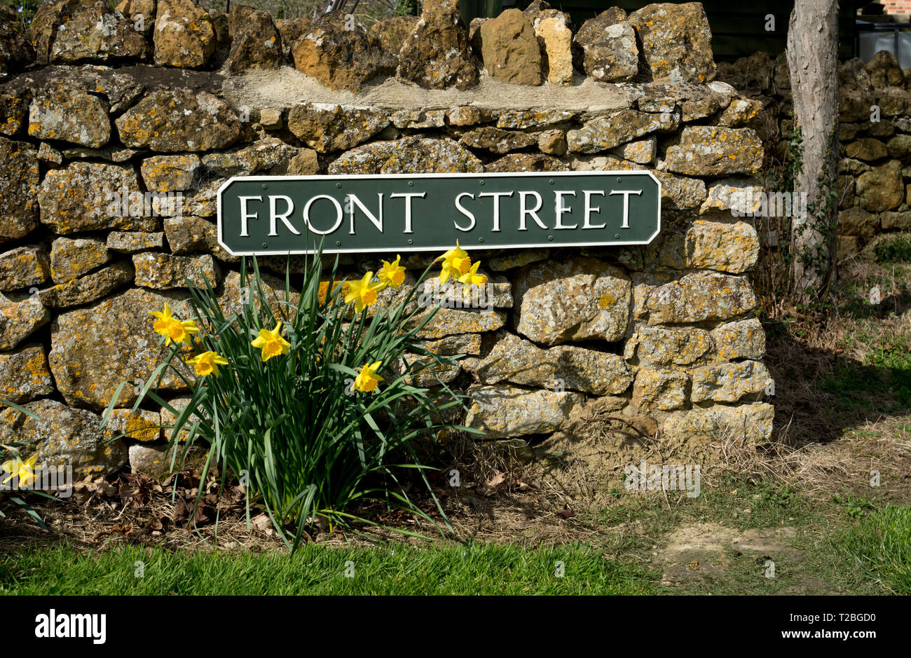 Front Street sign with daffodils in spring, Ilmington, Warwickshire ...