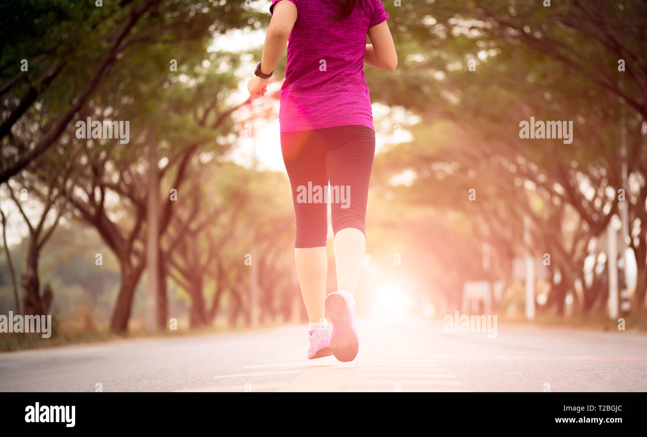 young sport girl runner athlete running at road. Sport and exercise ...