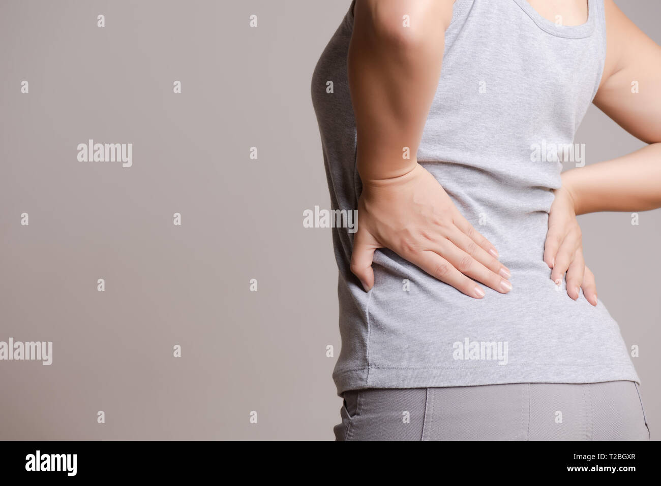 Close up woman having pain in injured back. Healthcare and back pain ...