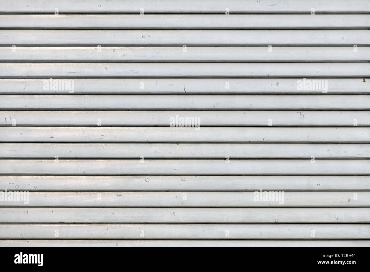 White vintage wooden boards in overlap cladding pattern, front view as ...