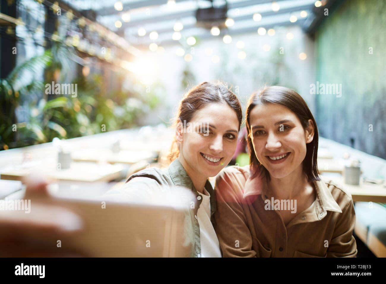 Taking photo with close friend Stock Photo - Alamy