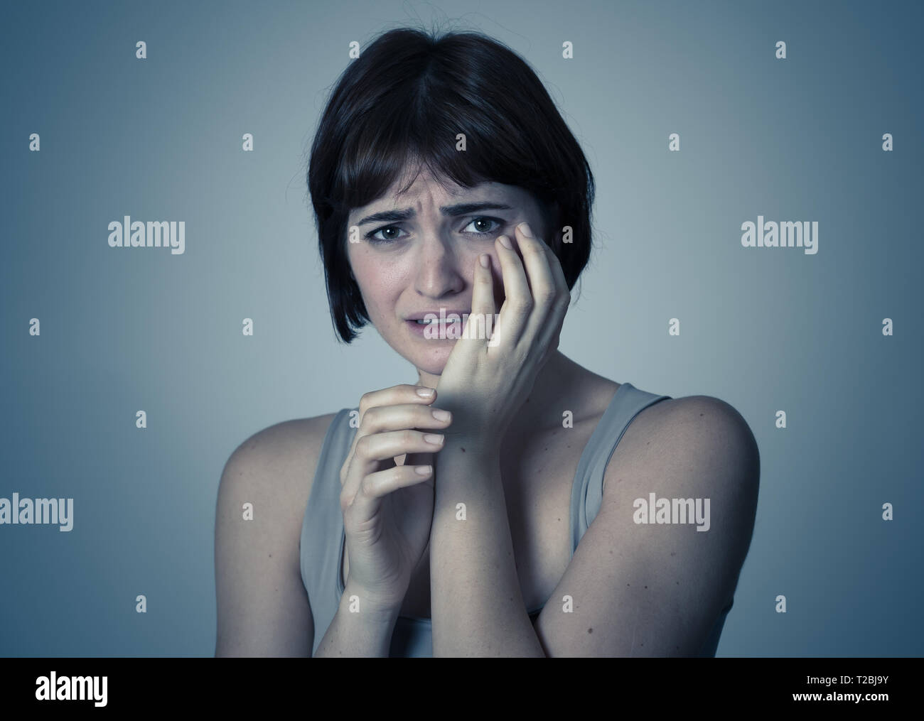 Portrait of young woman feeling scared and shocked making fear, anxiety ...