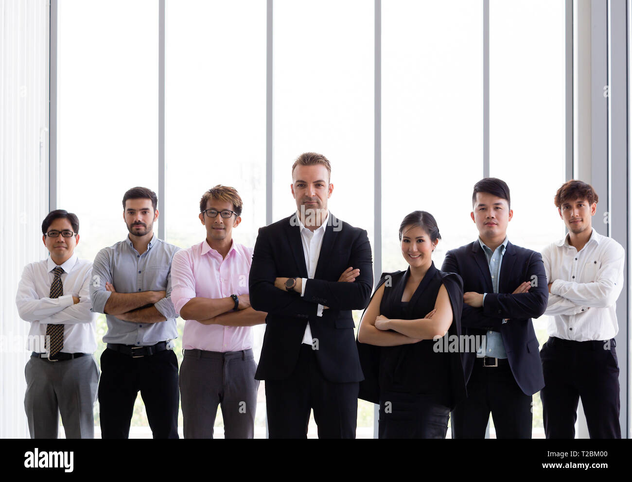 Group of confident business people in various diversity with arms ...