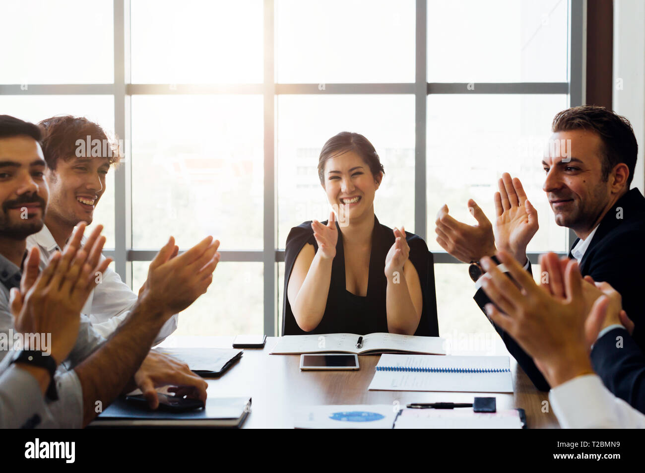 businesspersons clapping hands and applauding in business meeting ...