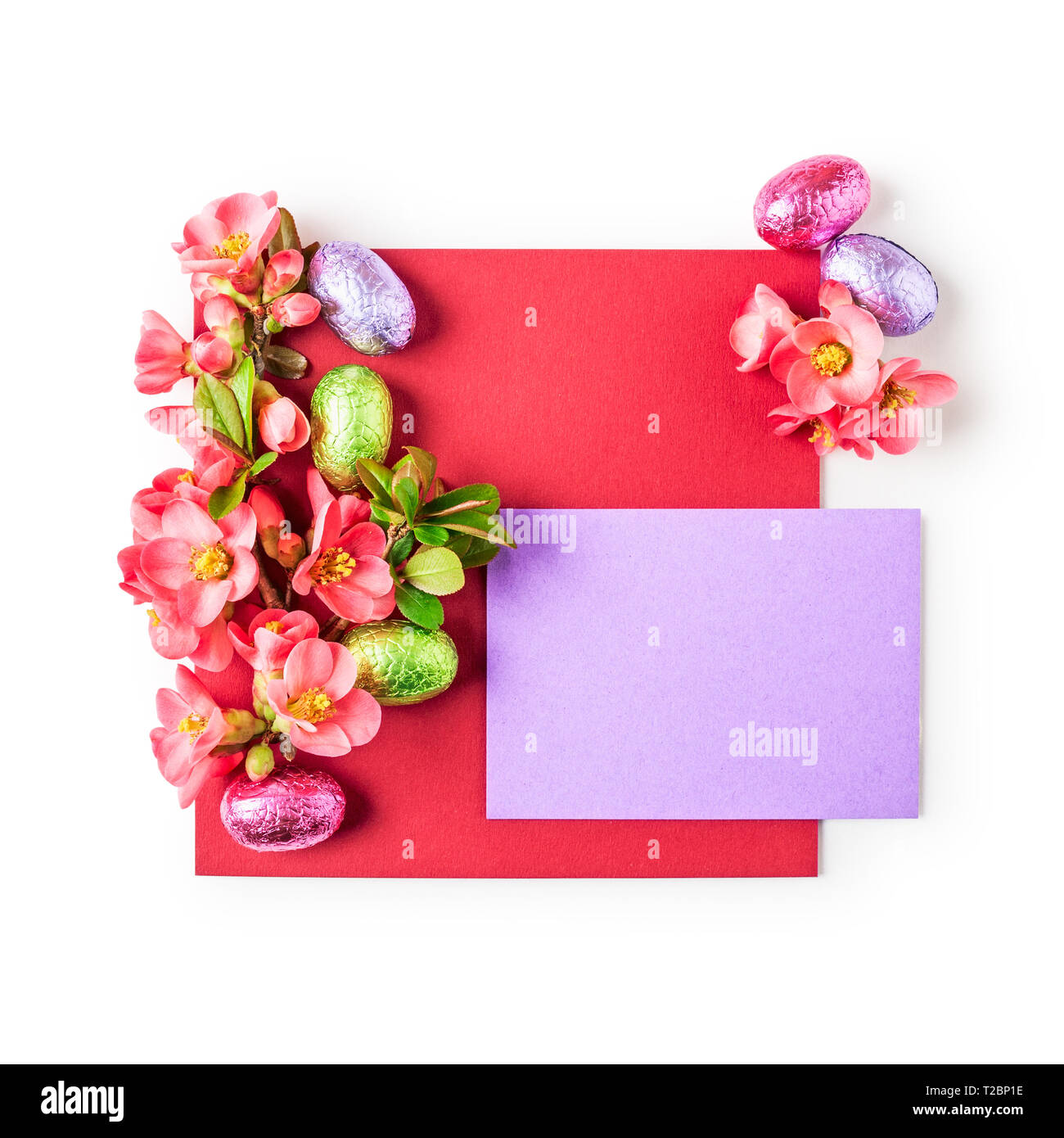 Easter greeting card with japanese quince flowers, chocolate eggs and ...