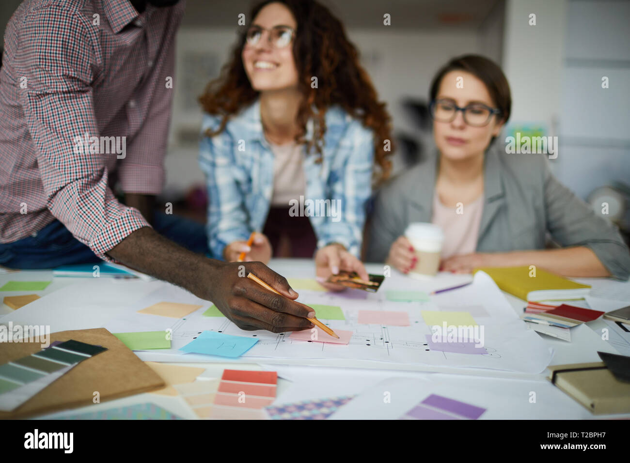 Portrait of creative business team planning project drawing roadmap in ...