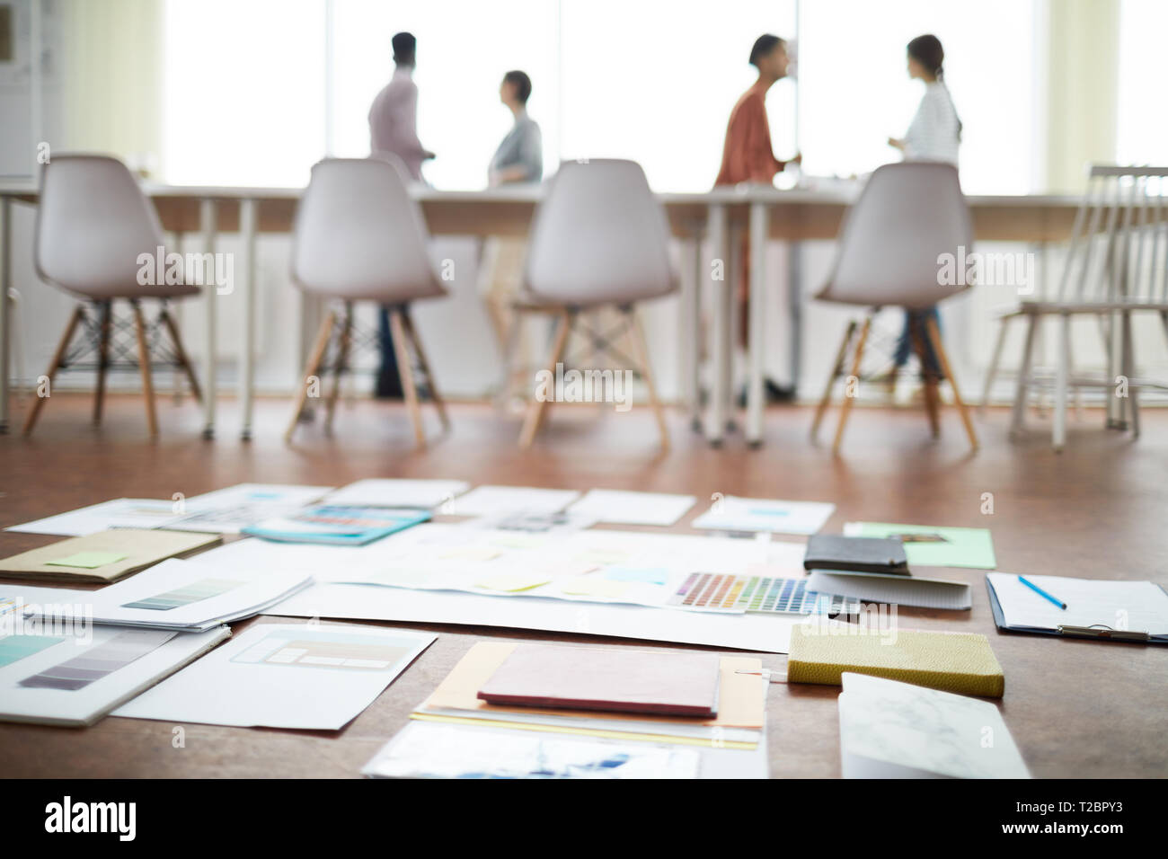 Background image of documents scattered on floor in office with ...