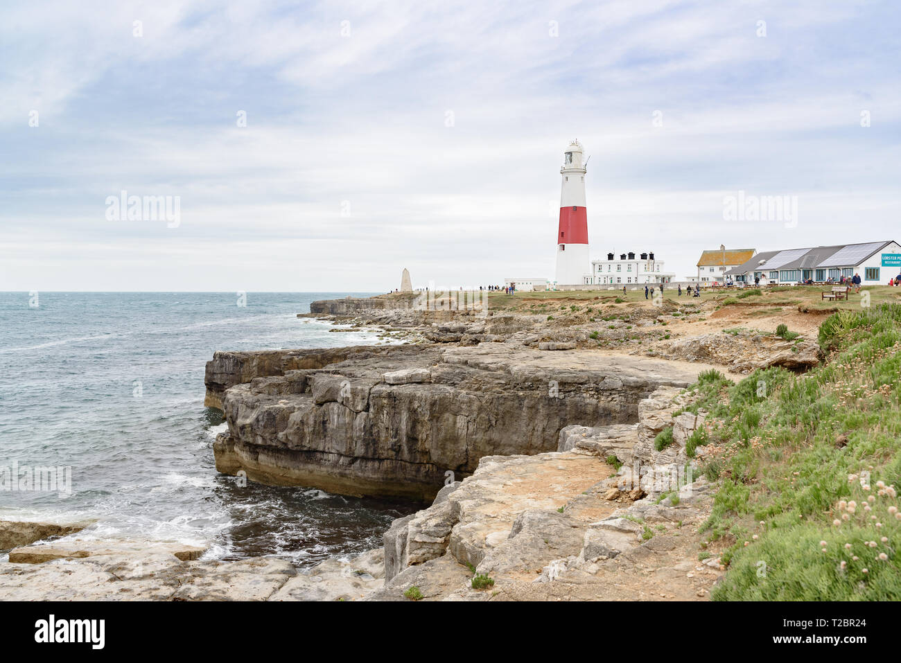 A view along the coast with the Portland Bill lighthouse at the back ...