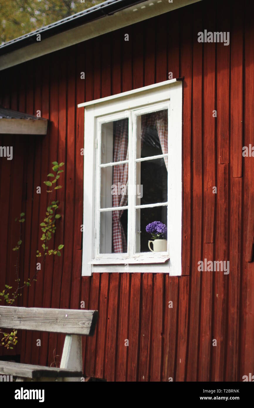 Window on a red wooden house in Sweden Stock Photo - Alamy