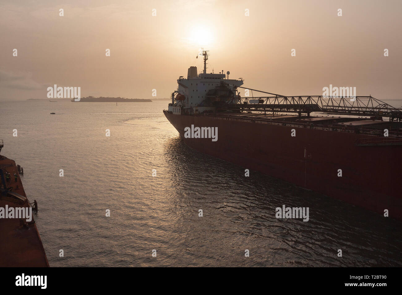 Port operations for managing and transporting iron ore. Sunrise across ...