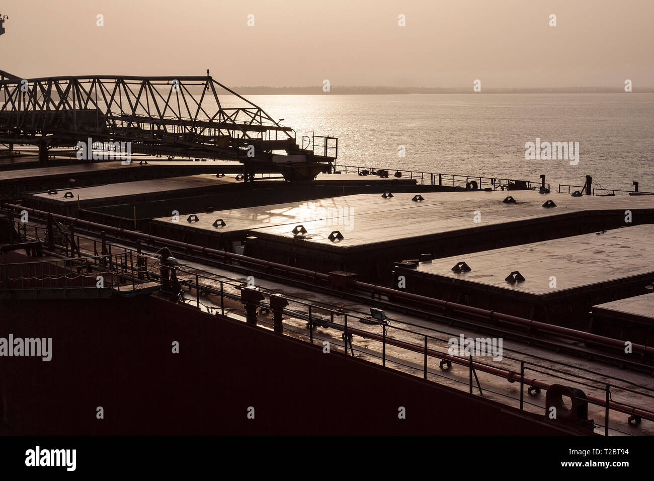 Port operations for managing and transporting iron ore. Sunrise across ...