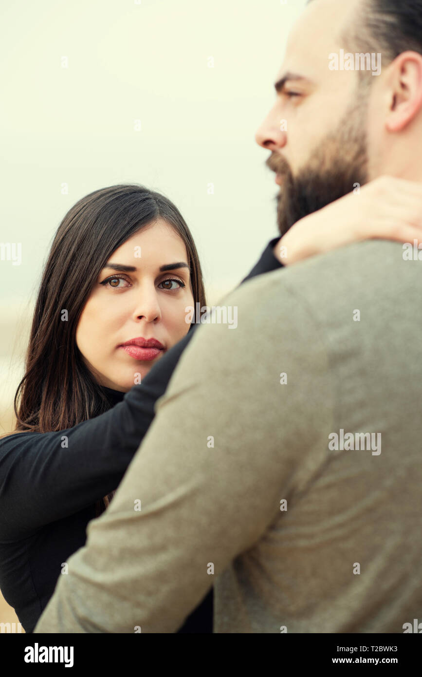 Man and woman hugging two people hi-res stock photography and images ...