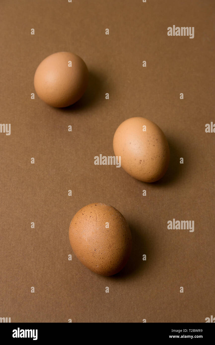 brown eggs pattern on a brown background Stock Photo - Alamy