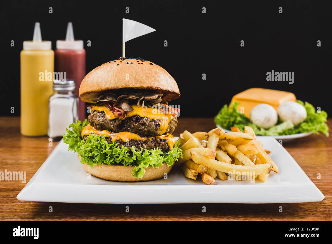 Doble burger with doble cheddar cheese, lettuce, bacon, mushrooms and ...