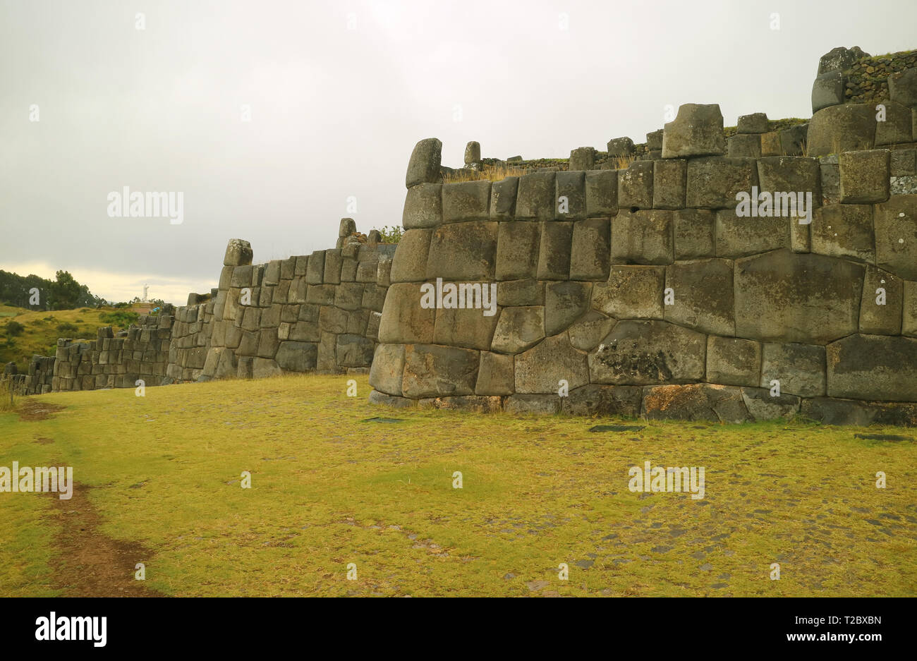 Incredible Inca stone walls of Sacsayhuaman fortress with statue of the ...