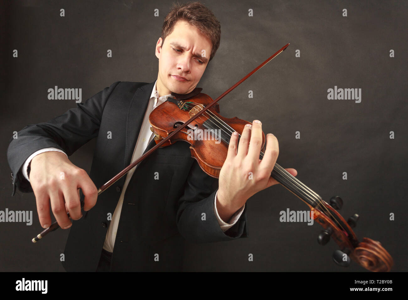 Music passion, hobby concept. Man playing violin showing hard emotions ...