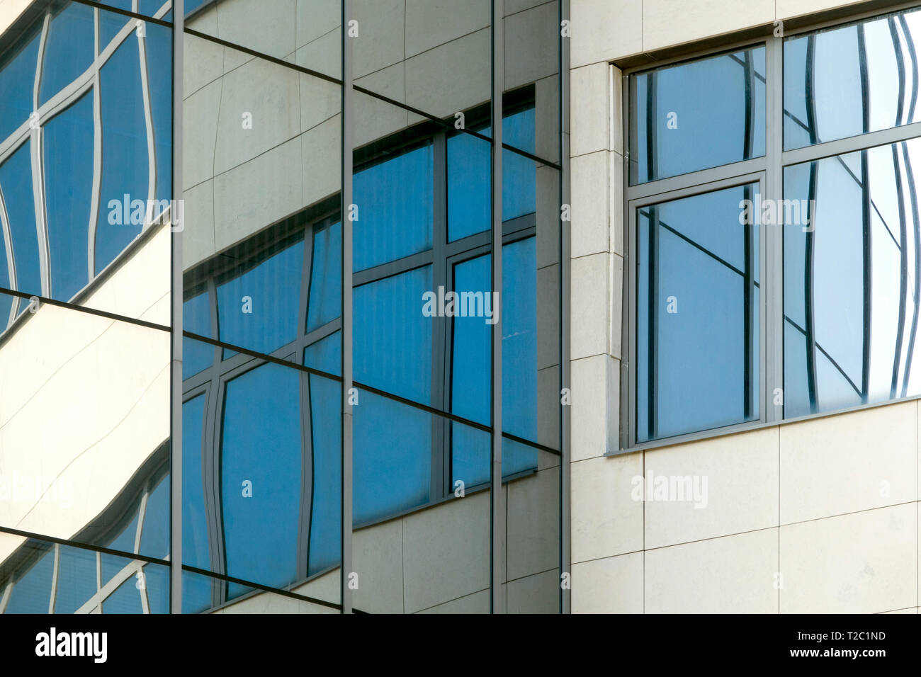 Abstract reflection in windows of modern building Stock Photo - Alamy