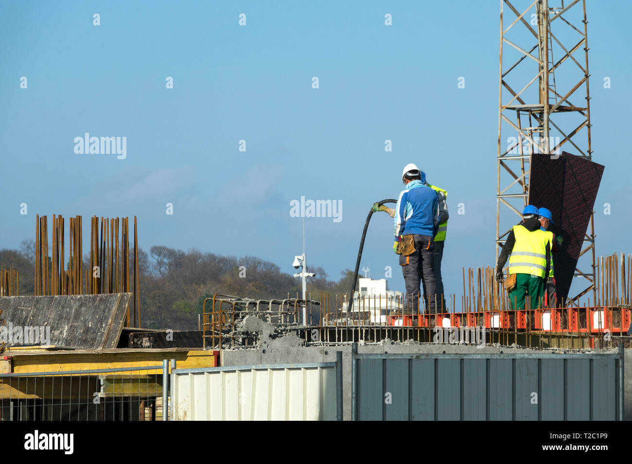Construction workers working on new construction Stock Photo - Alamy