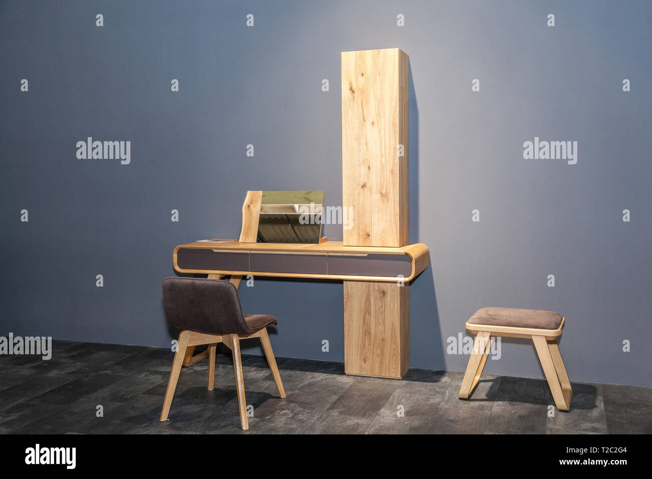 modern wooden workplace with console table on grey wall background ...