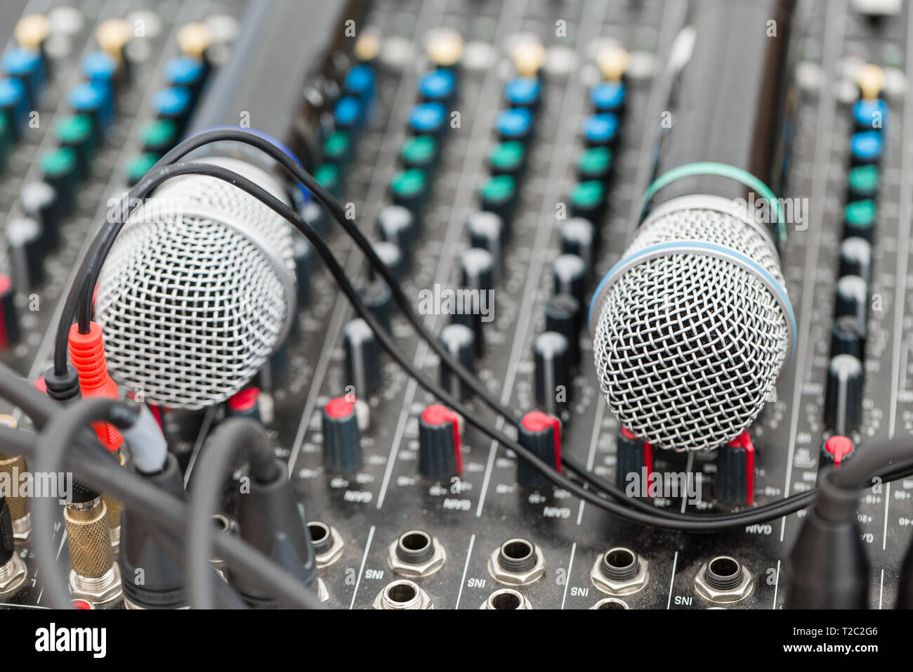 Microphone close-up. Focus on mic. Event concept. Music mixer equalizer ...