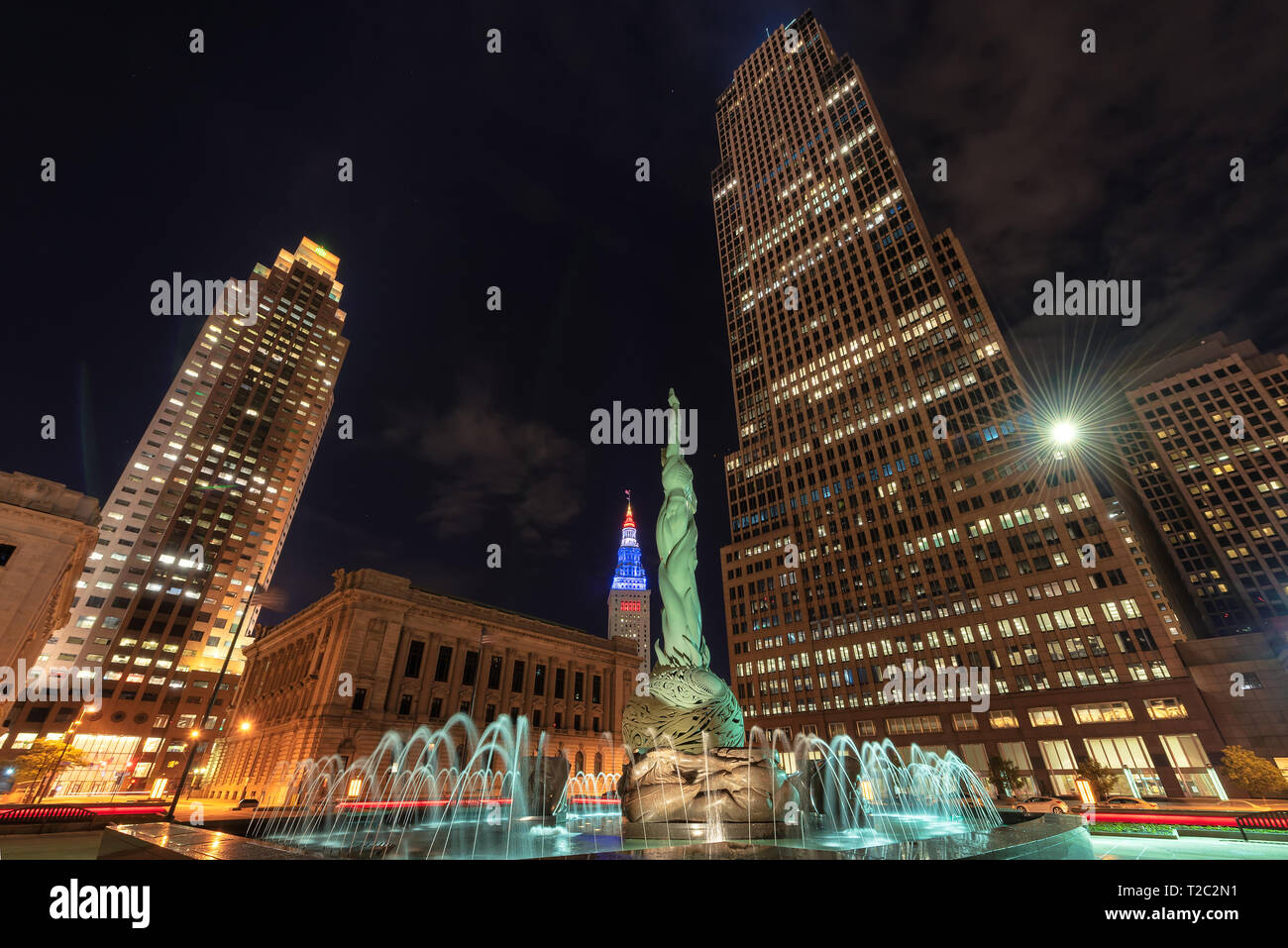 Night view of Cleveland Downtown and Fountain of Eternal Life Statue ...