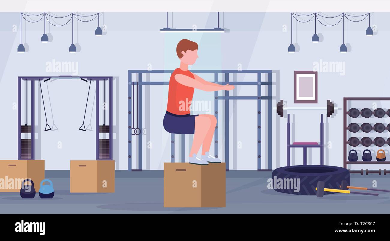 sports man doing box squat exercises guy jumping working out in gym ...