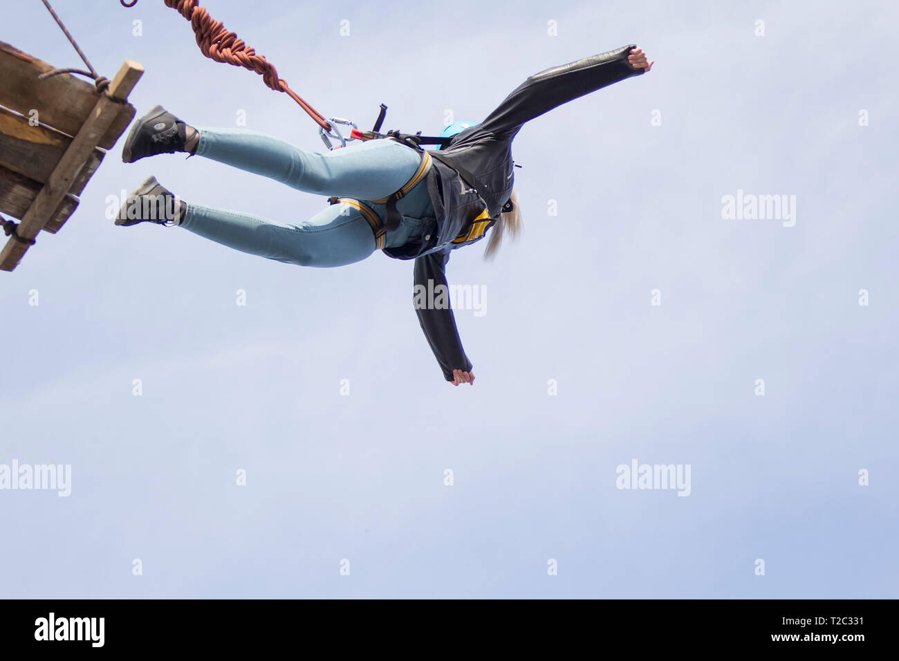 Belarus, Gomel, March 08, 2019. Jumping from the bridge to the rope ...