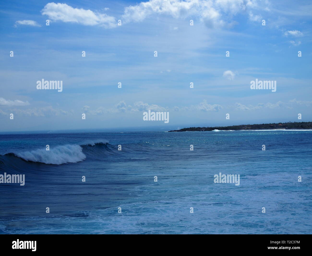 Surfing at Mahana Point, Ceningan Island, Nusa Penida, Indonesia Stock ...