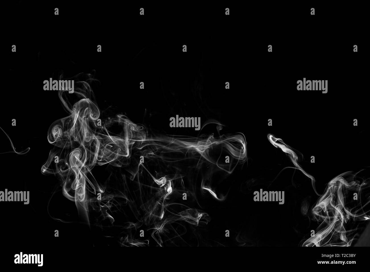 white smoke flame on a black background Stock Photo - Alamy