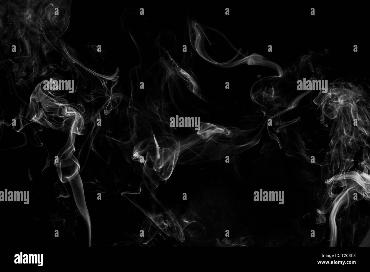 white smoke flame on a black background Stock Photo - Alamy