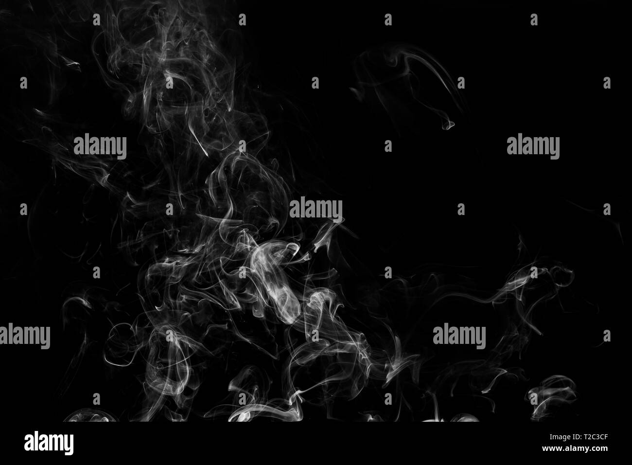 white smoke flame on a black background Stock Photo - Alamy