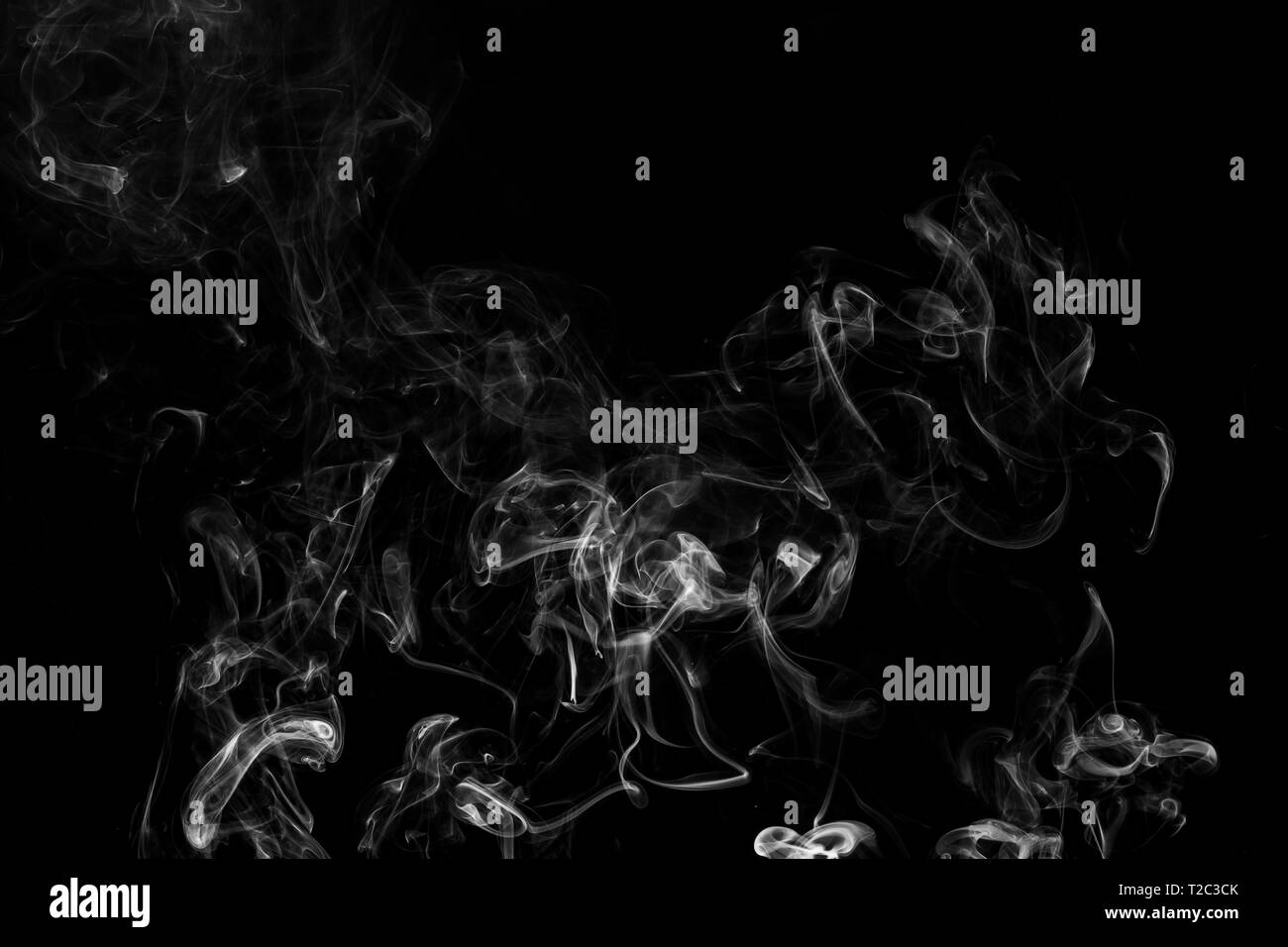 white smoke flame on a black background Stock Photo - Alamy