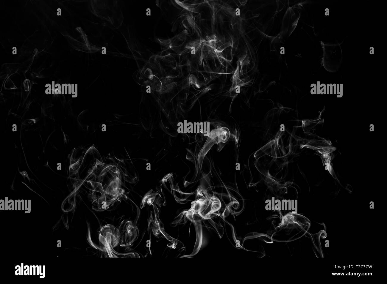 white smoke flame on a black background Stock Photo - Alamy