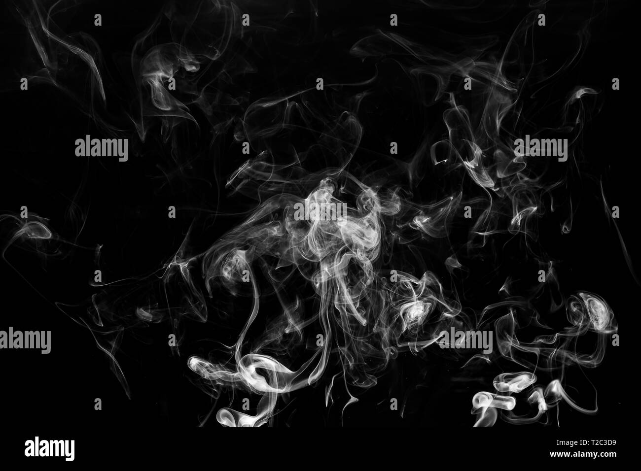 white smoke flame on a black background Stock Photo - Alamy