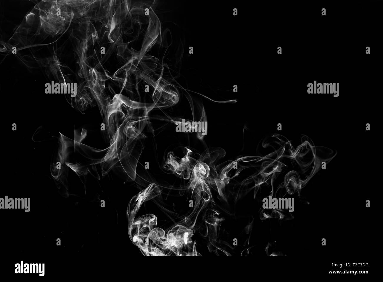 white smoke flame on a black background Stock Photo - Alamy