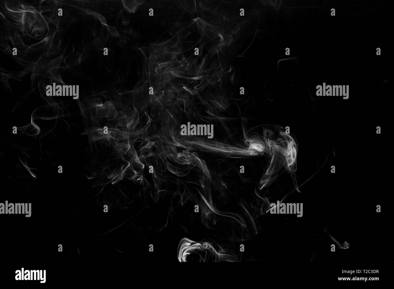 white smoke flame on a black background Stock Photo - Alamy