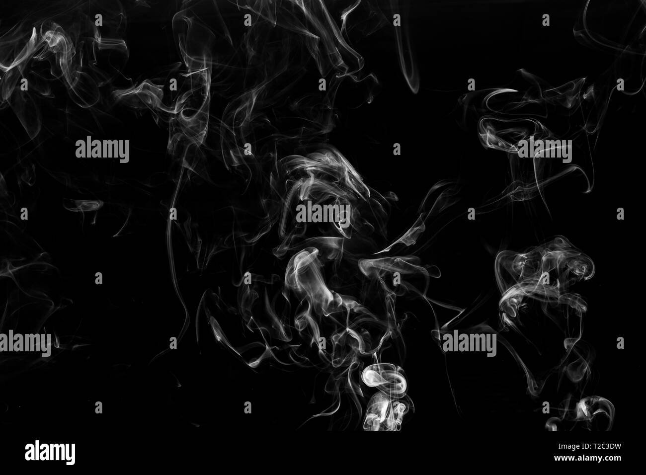 white smoke flame on a black background Stock Photo - Alamy
