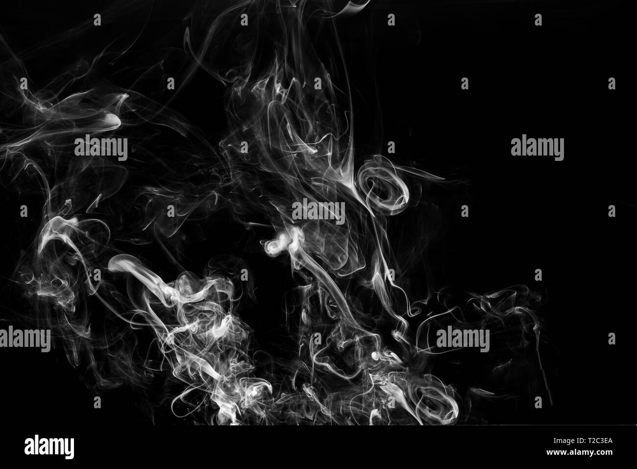 white smoke flame on a black background Stock Photo - Alamy