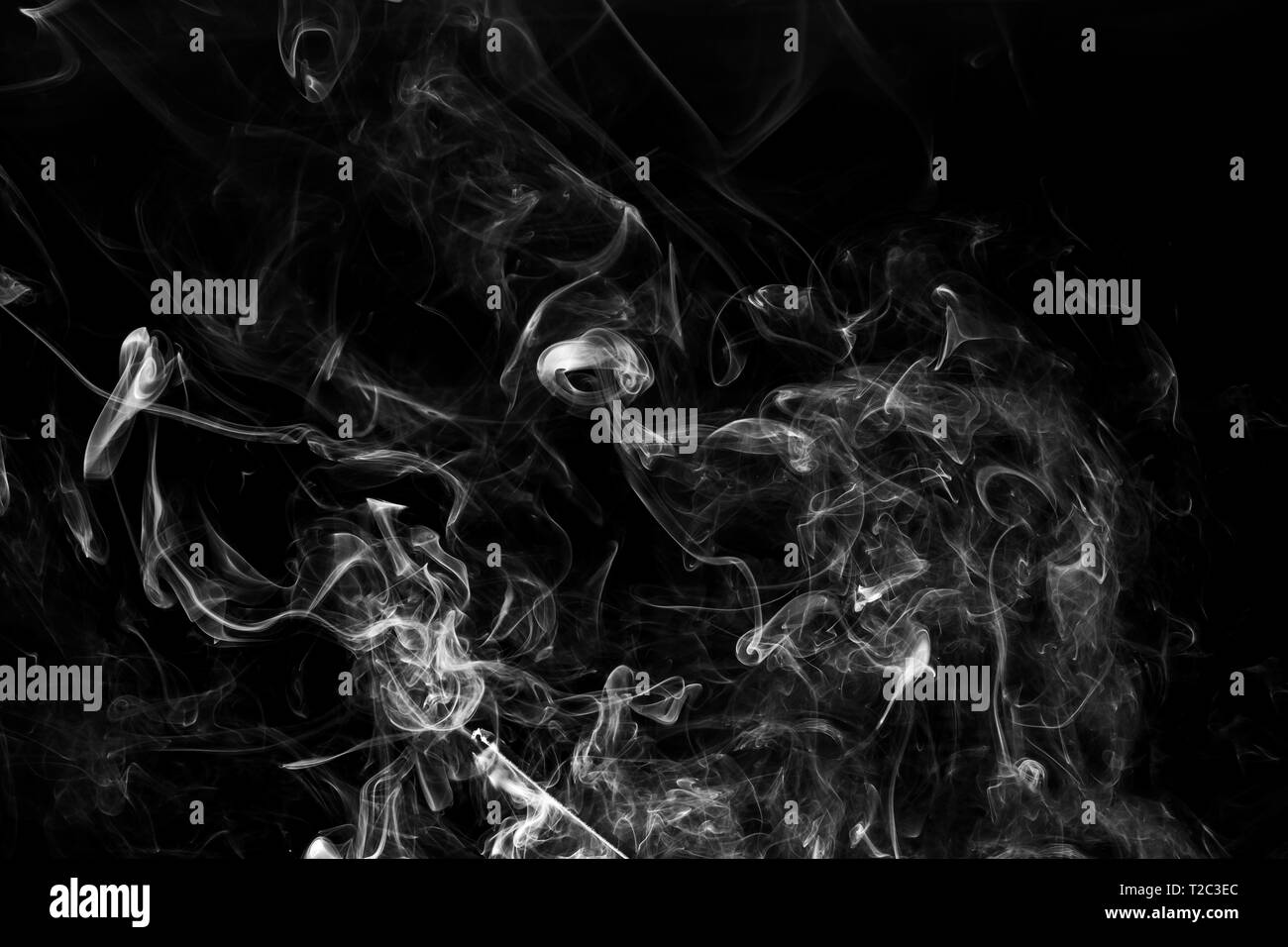 white smoke flame on a black background Stock Photo - Alamy