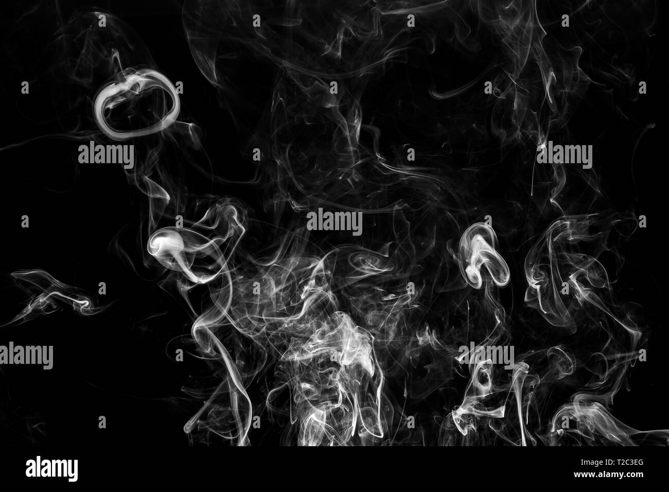 white smoke flame on a black background Stock Photo - Alamy