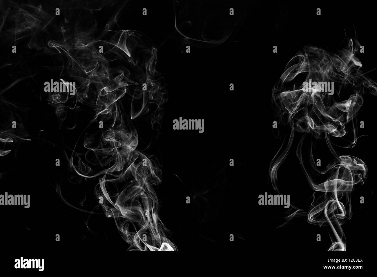 white smoke flame on a black background Stock Photo - Alamy