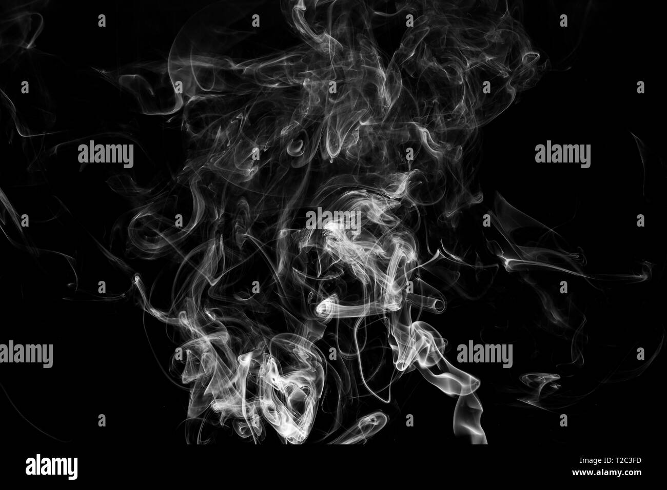 white smoke flame on a black background Stock Photo - Alamy
