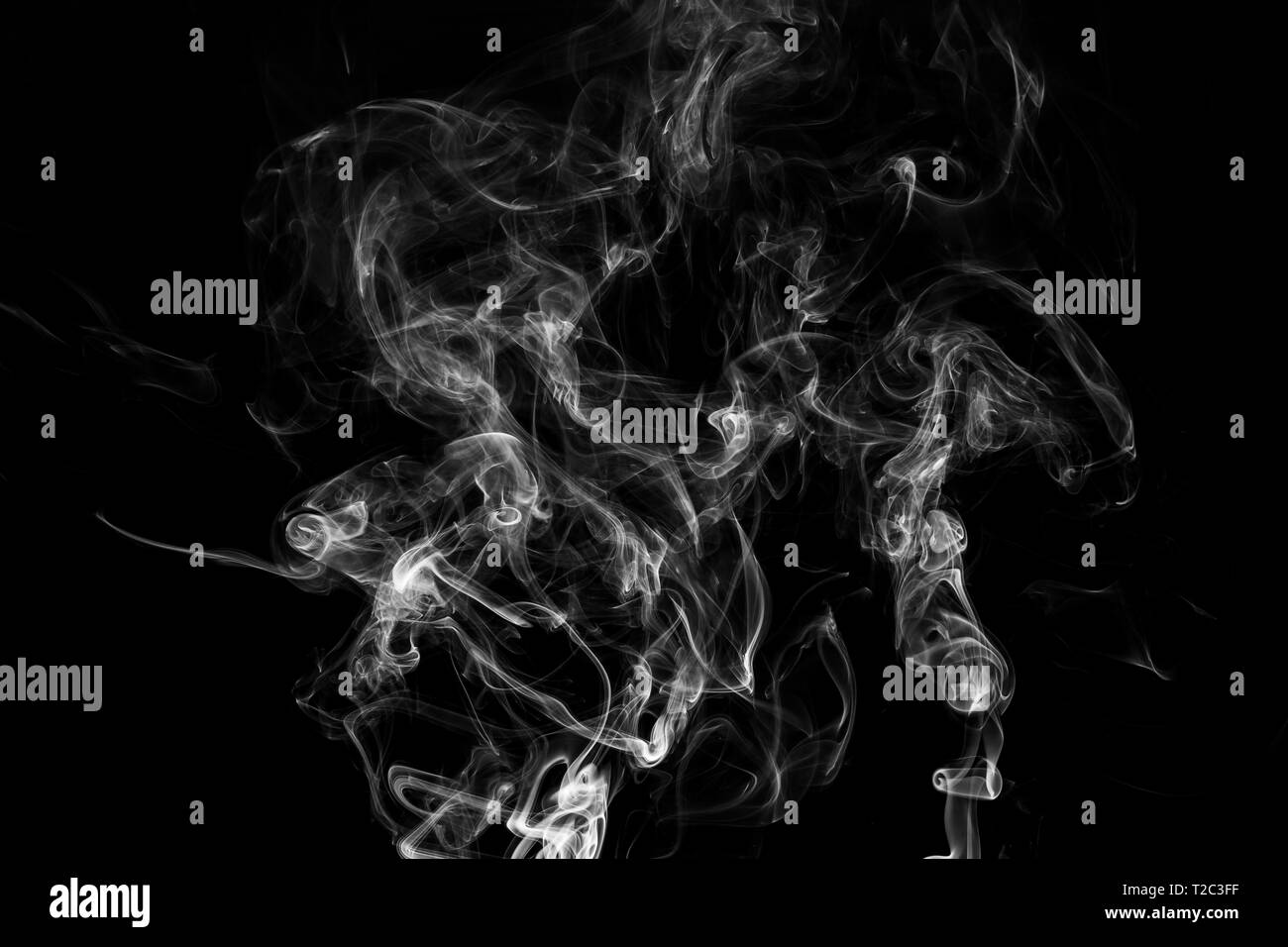 white smoke flame on a black background Stock Photo - Alamy