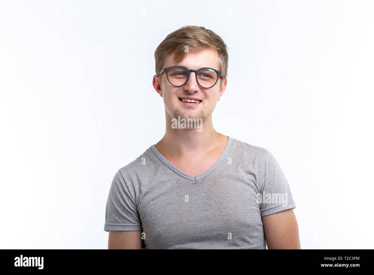 Geek, education, people concept - young man over the white background ...