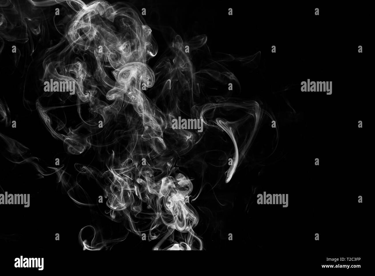 white smoke flame on a black background Stock Photo - Alamy