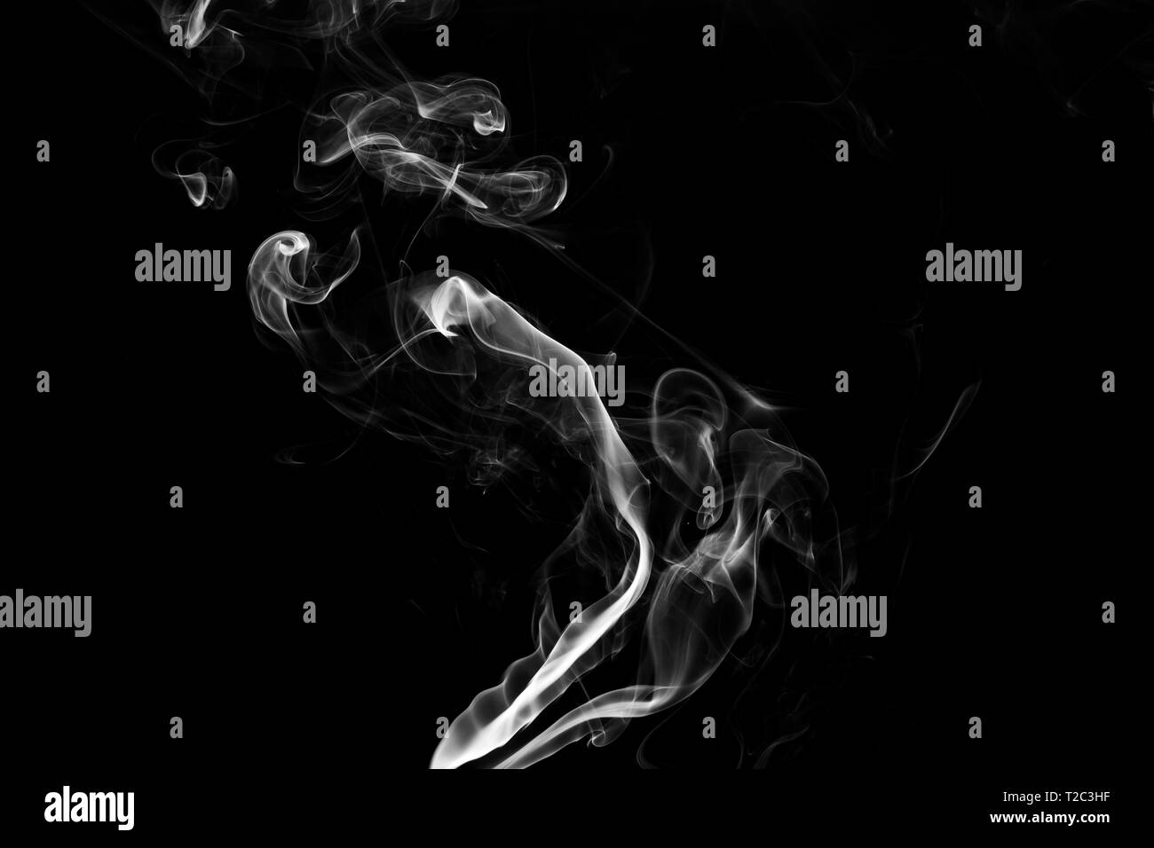 white smoke flame on a black background Stock Photo - Alamy