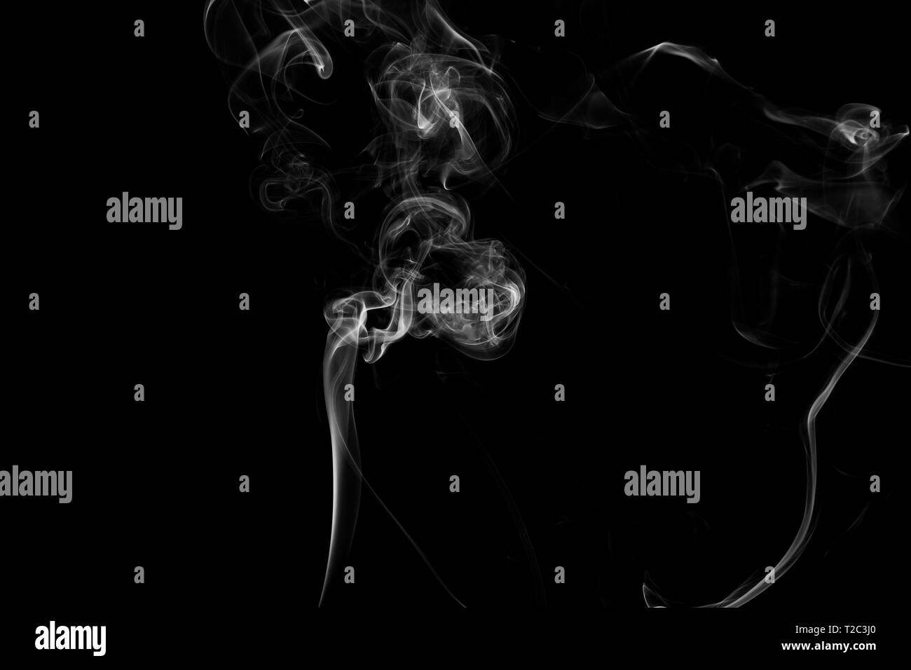 white smoke flame on a black background Stock Photo - Alamy
