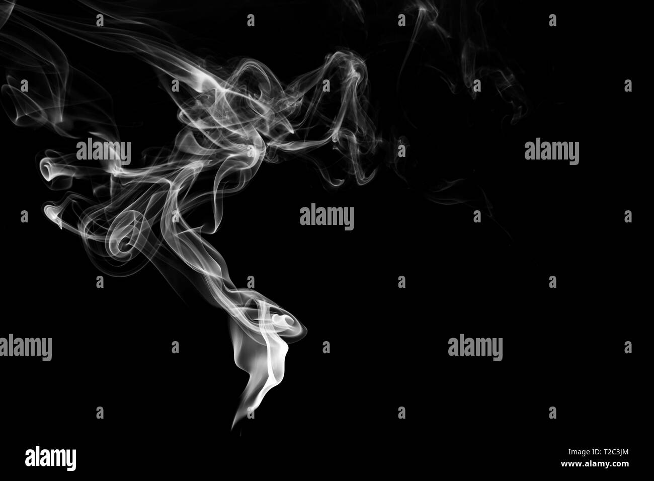 white smoke flame on a black background Stock Photo - Alamy